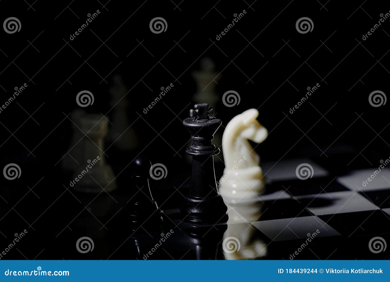Chess Pieces on a Chessboard in a Dark Room Illuminated by a Lamp Stock ...