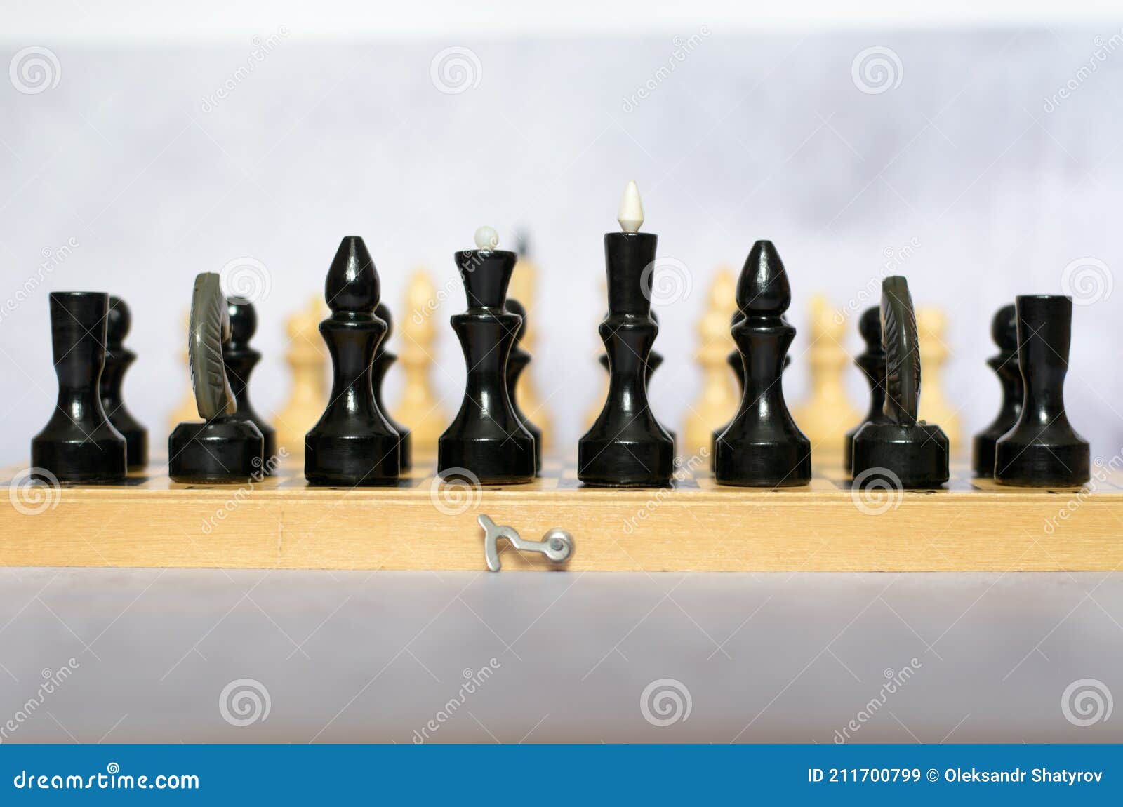 Chess Pieces on a Chessboard Side View. Black Pieces in the Foreground ...