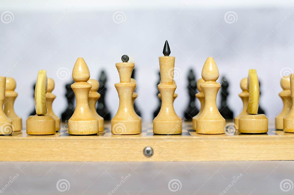 Chess Pieces on a Chessboard Side View. White Pieces in the Foreground ...