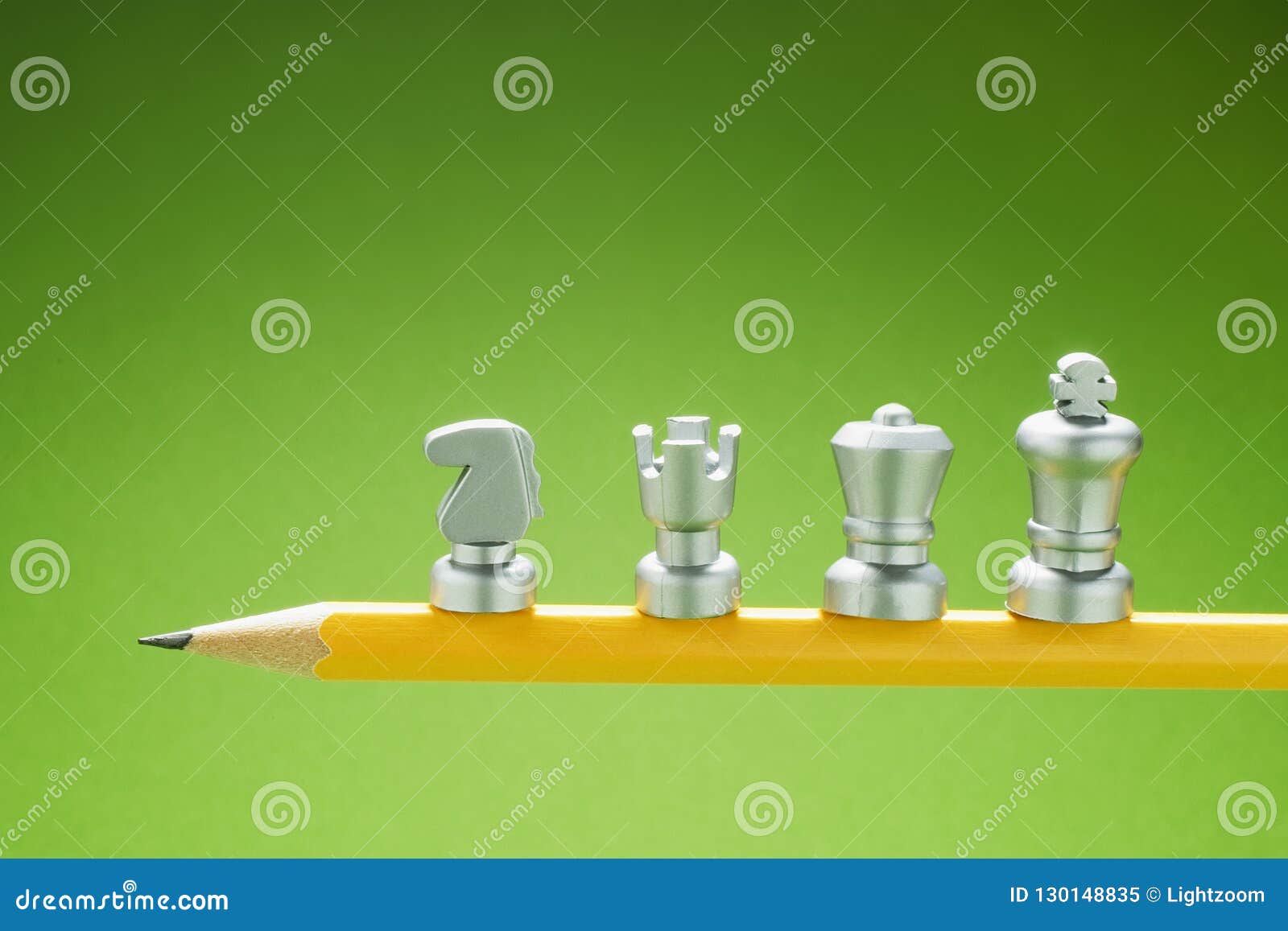 Chess Pieces on Pencil stock image. Image of objects - 130148835