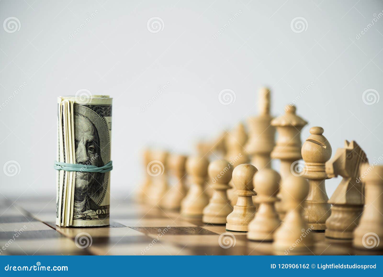 Chess Pieces and Rolled Up Cash on Chess Board Stock Photo - Image of ...