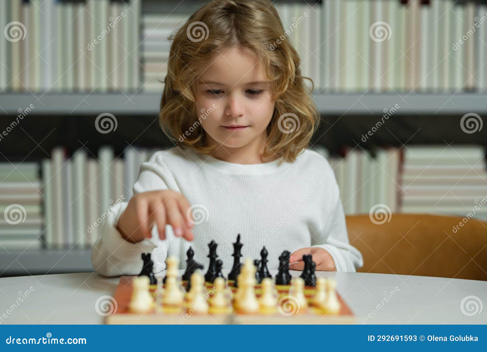 Chess School. Concentrated Child Play Chess. Kid Playing Board Game in ...
