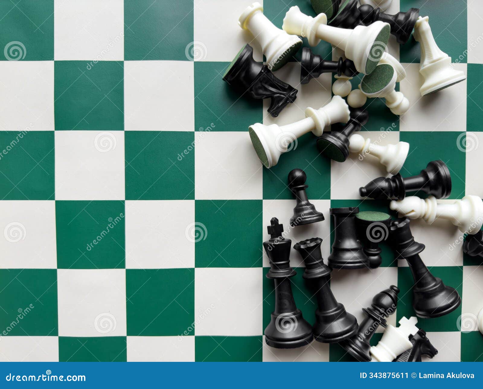 Chessboard and Fallen Chess Pieces on Green and White Checkered Board ...