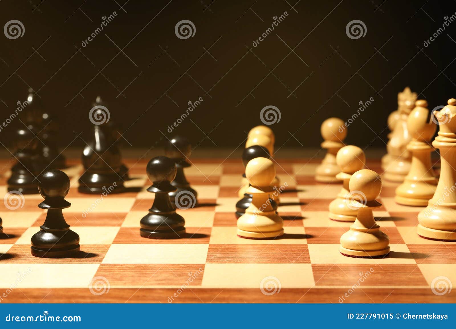 Chessboard with Game Pieces on Black Background Stock Image - Image of ...