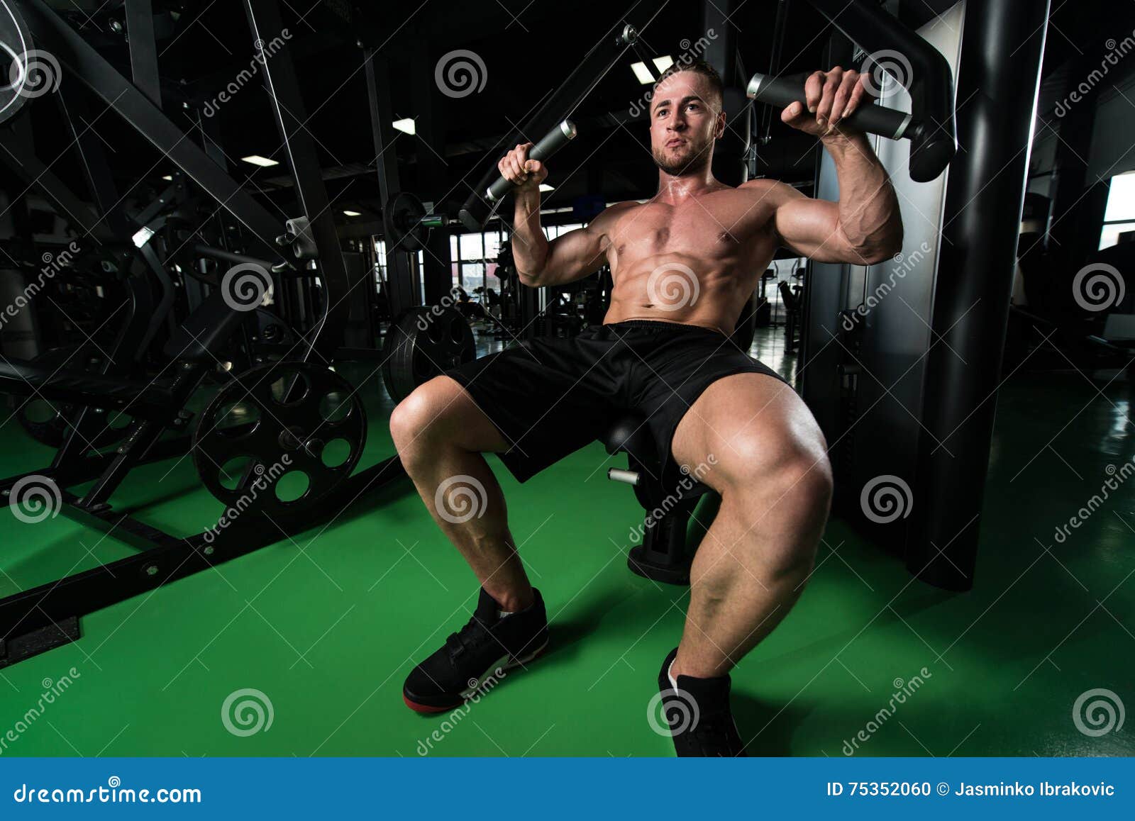 Chest Exercise in a Gym stock photo. Image of build, muscle - 75352060