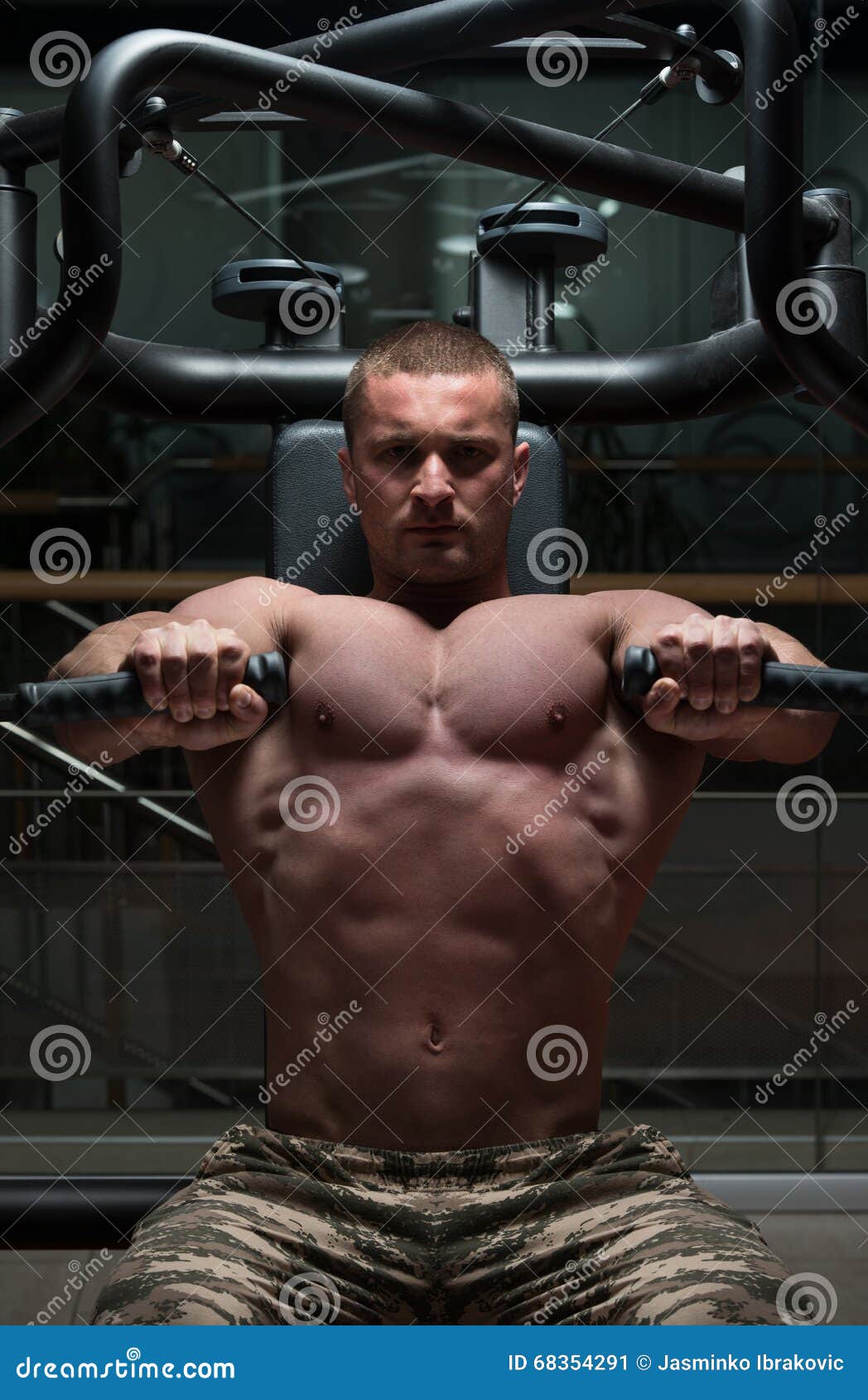 Chest Exercises on a Machine Stock Image - Image of clothing, athlete ...