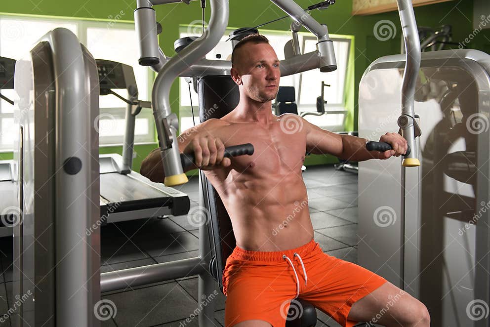 Chest Exercises on a Machine Stock Photo - Image of healthy, build ...