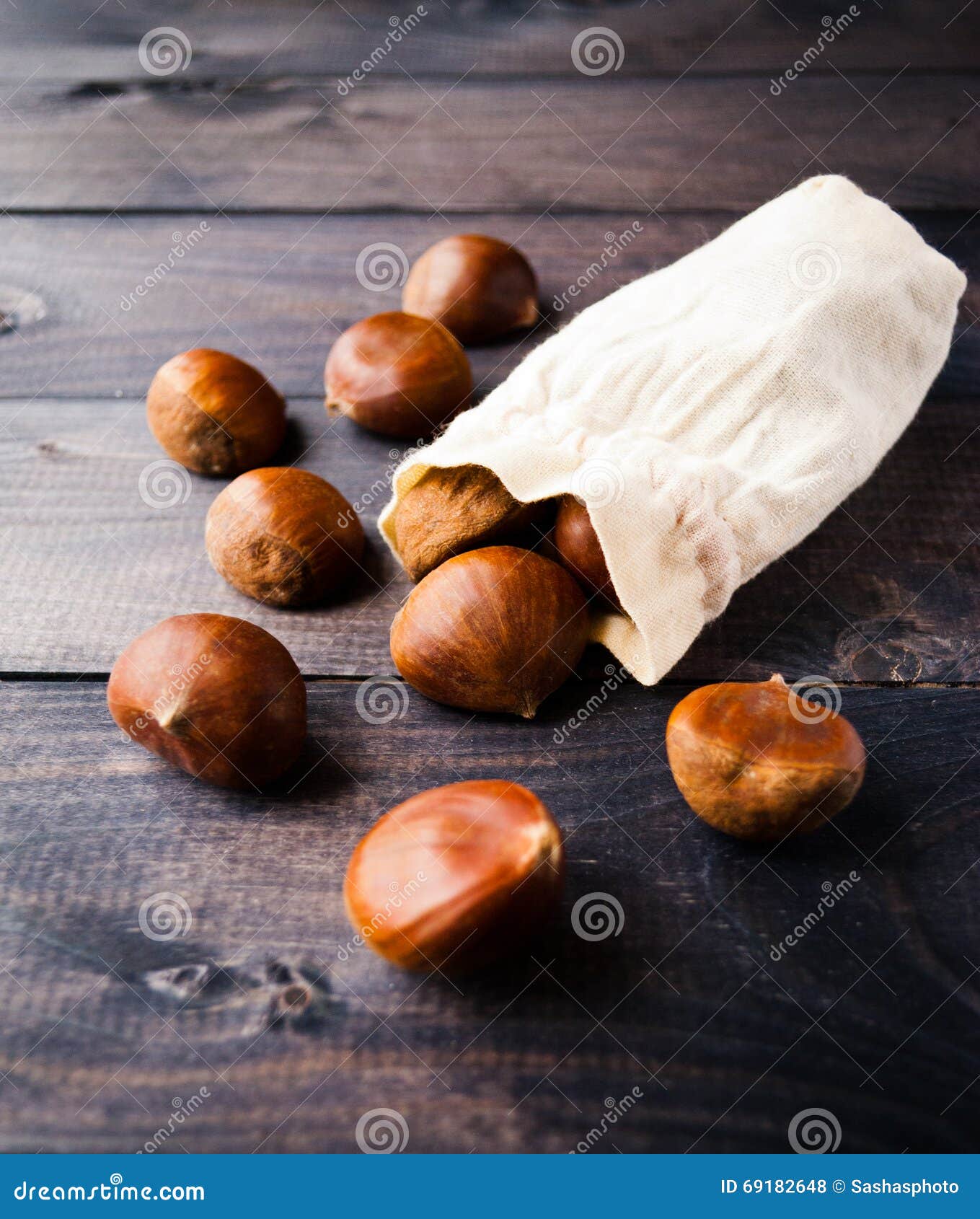 Chestnuts in cotton bag stock photo. Image of nutty, seasonal - 69182648