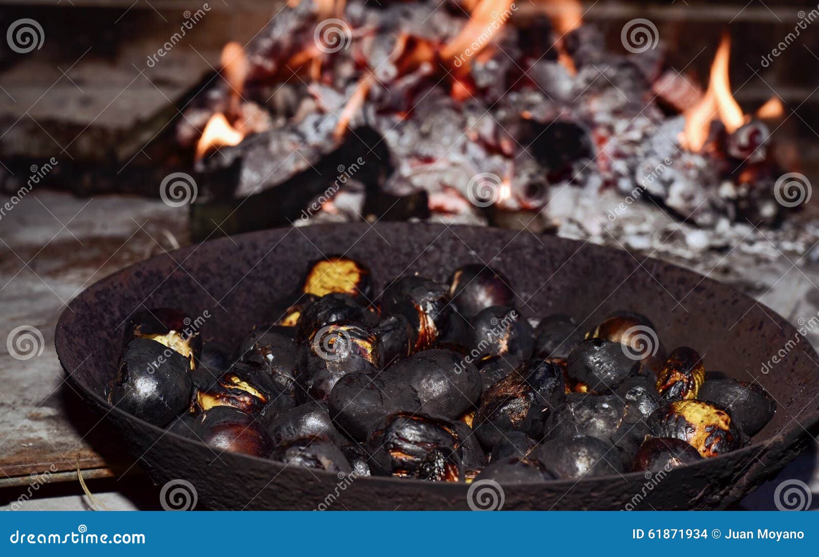 Chestnuts Roasting in the Flames of a Log Fire Stock Photo - Image of ...