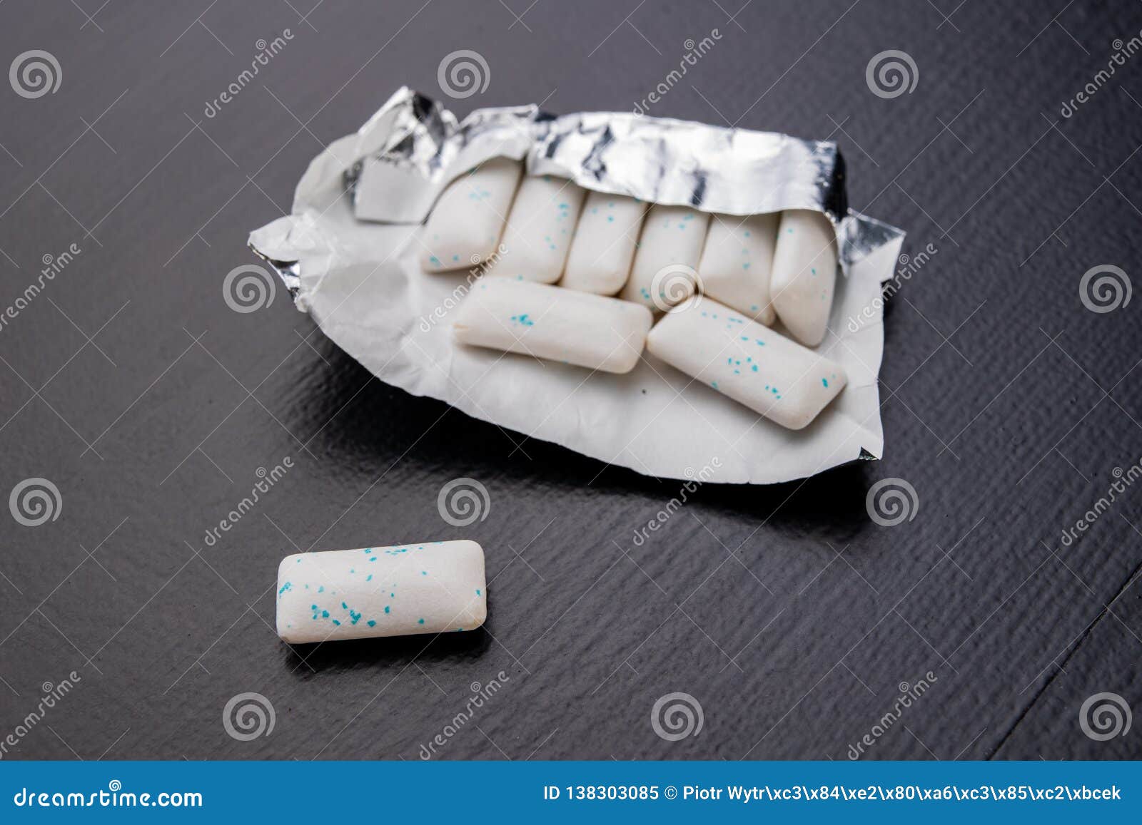 Chewing Gum on the Table. Mint Refreshing Tablet in a Silver Package ...