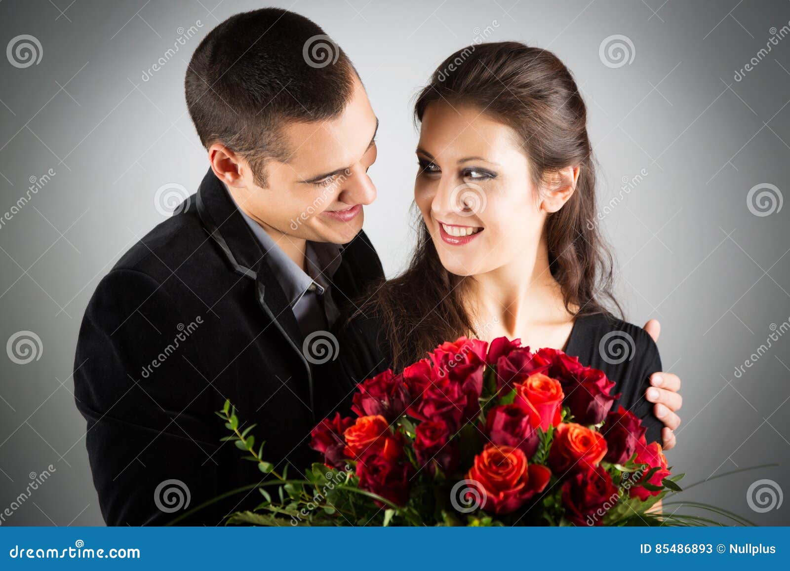 Chic Valentine`s Couple with Bouquet of Roses Stock Image - Image of ...