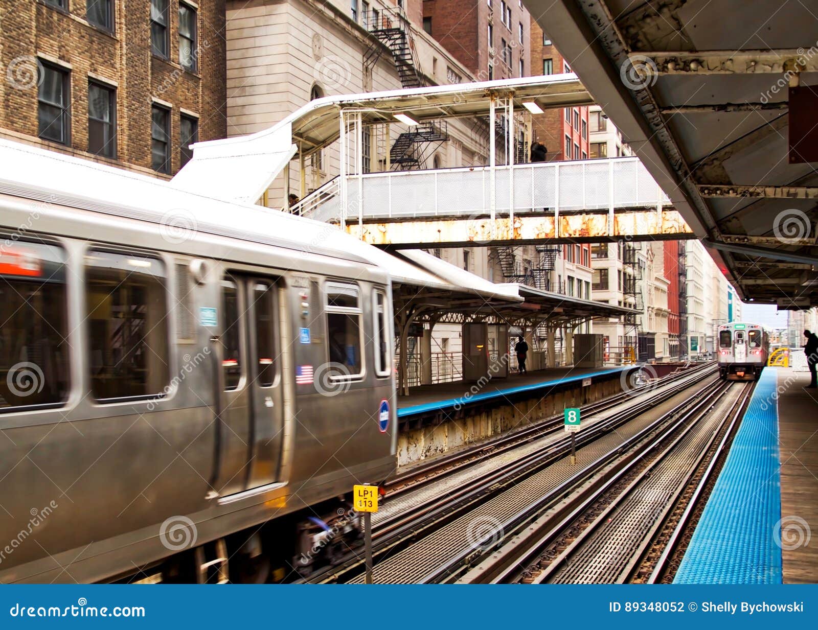 Orange Line Elevated "el" Train Entering Station in Foreground, while ...