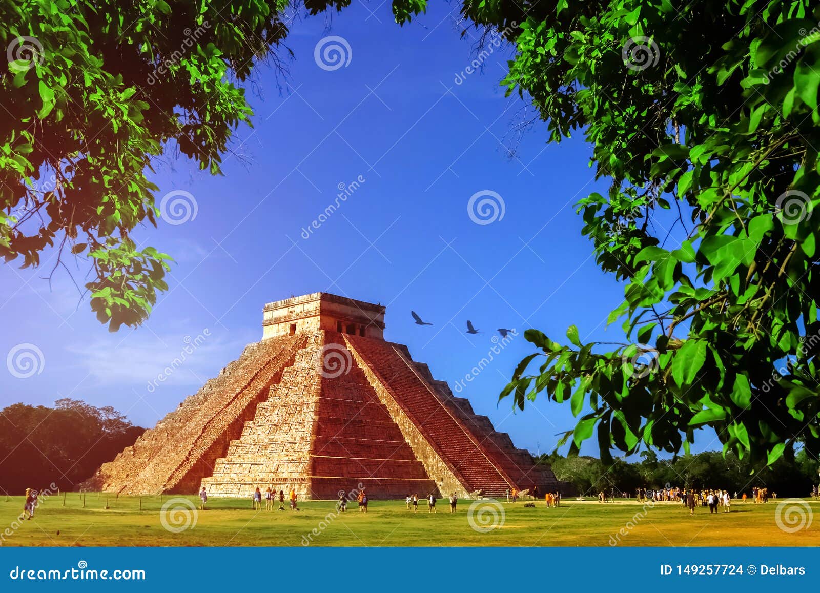 Chichen Itza Pyramid On The Background Of Bright Blue Sky. The Most ...