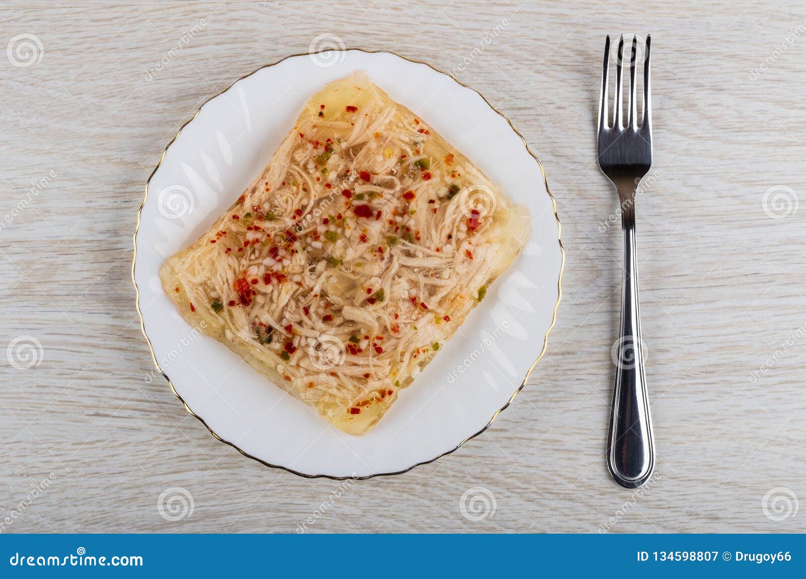 Chicken Aspic in Plate and Fork on Table. Top View Stock Image - Image ...