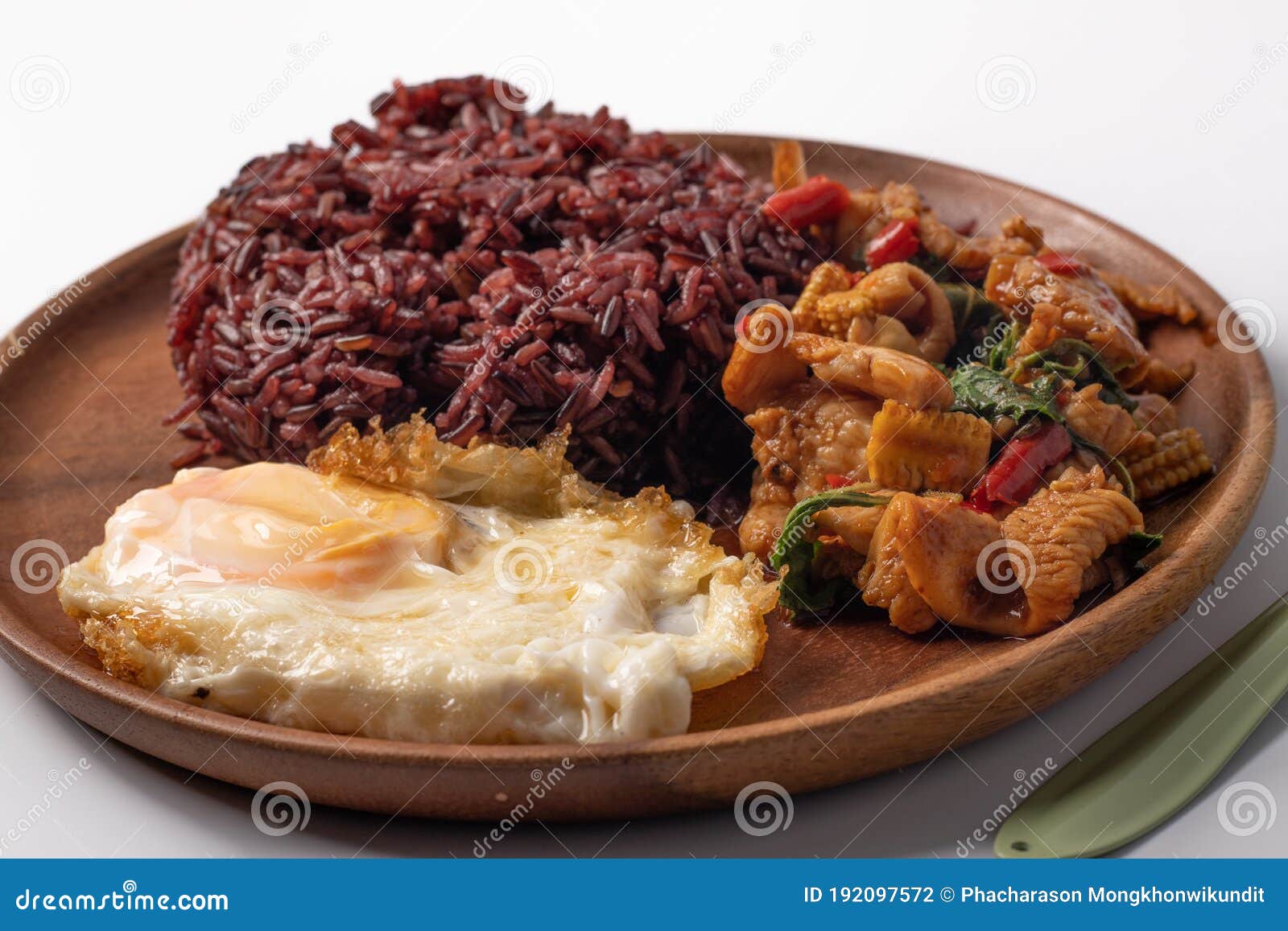 Chicken Basil with Fried Egg and Riceberry Rice Stock Photo - Image of ...
