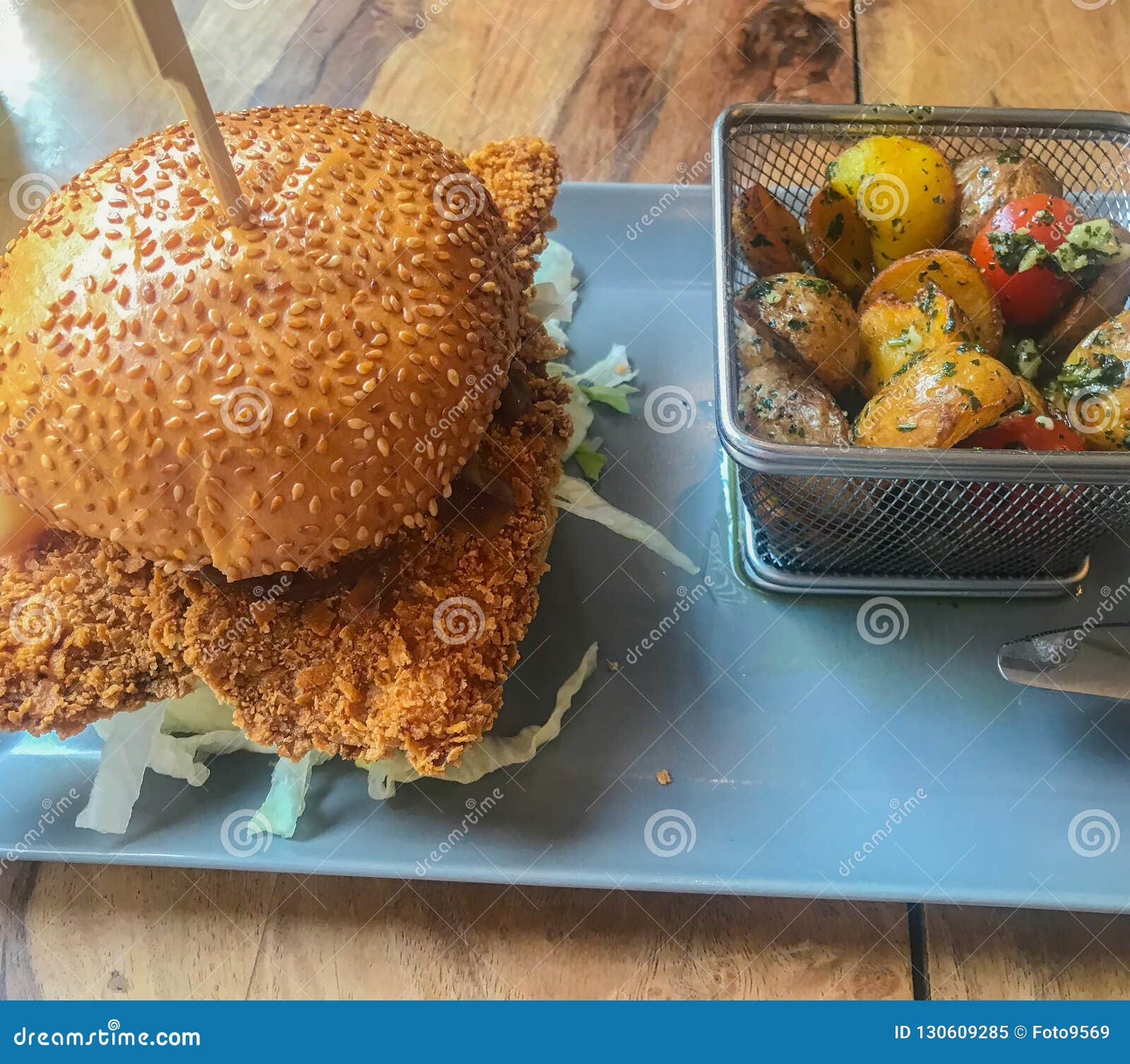 Chicken burger on a plate stock image. Image of rolls - 130609285