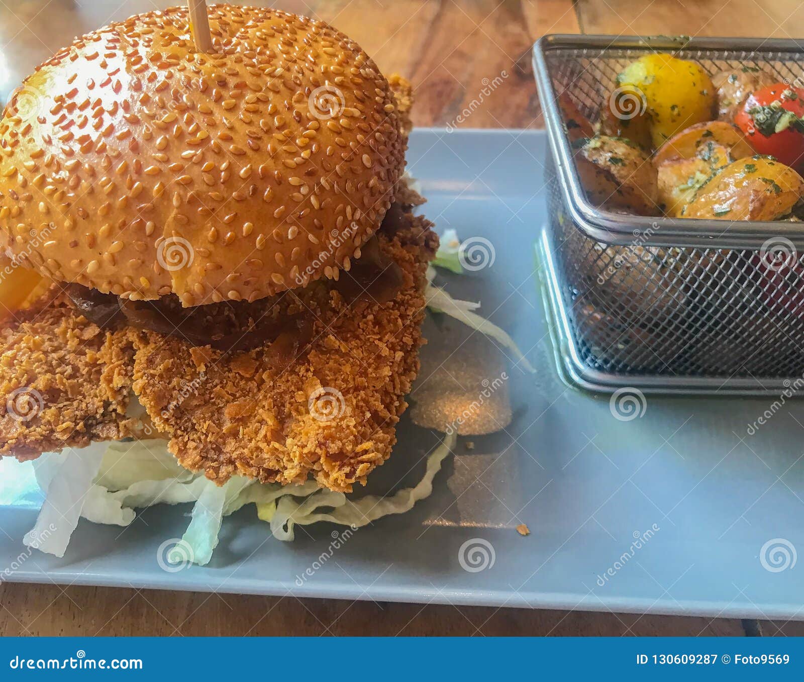 Chicken burger on a plate stock image. Image of ketchup - 130609287