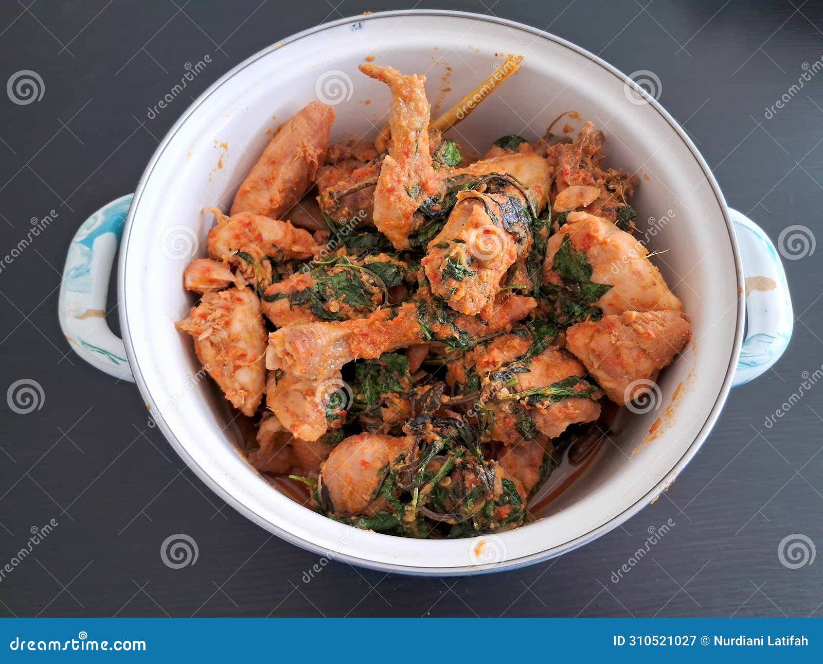 Chicken Cooking Basil in a Pan on a Black Background Stock Image ...