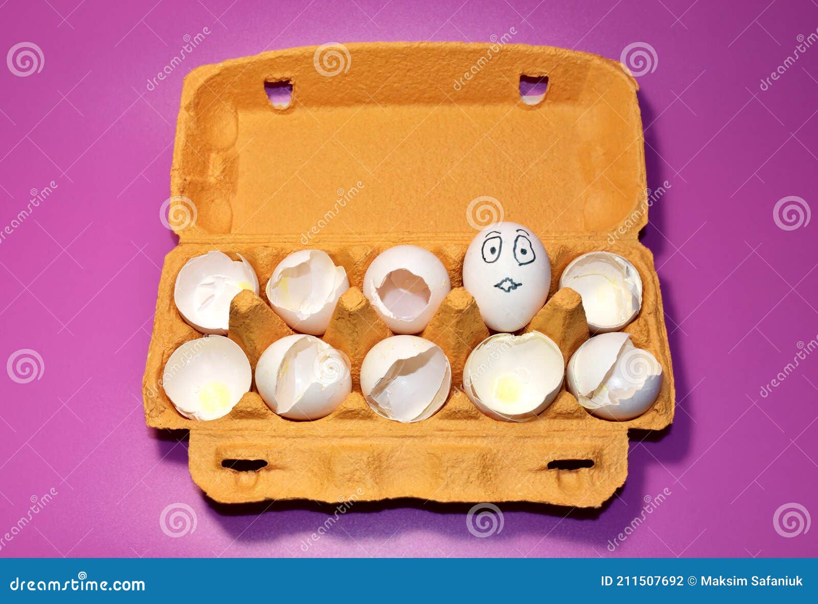 Chicken Egg in a Cardboard with Painted Emotions on Shell among Broken ...