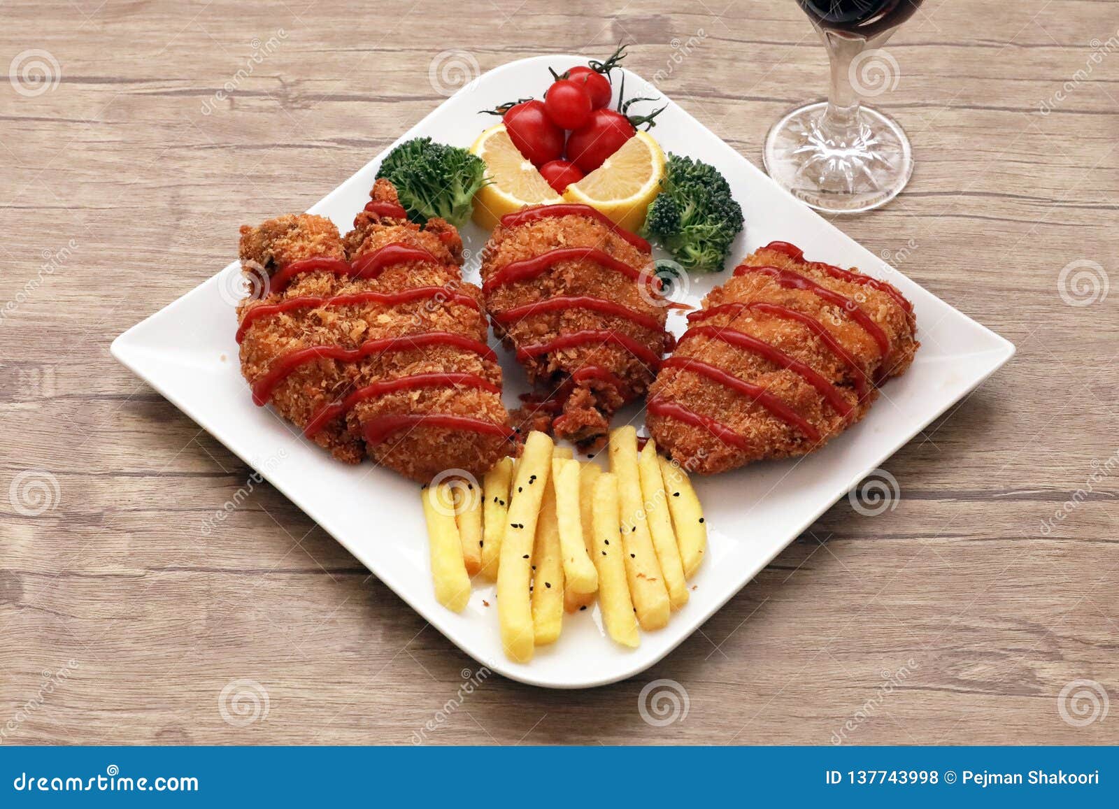 Chicken and fried potatoes stock photo. Image of fried - 137743998