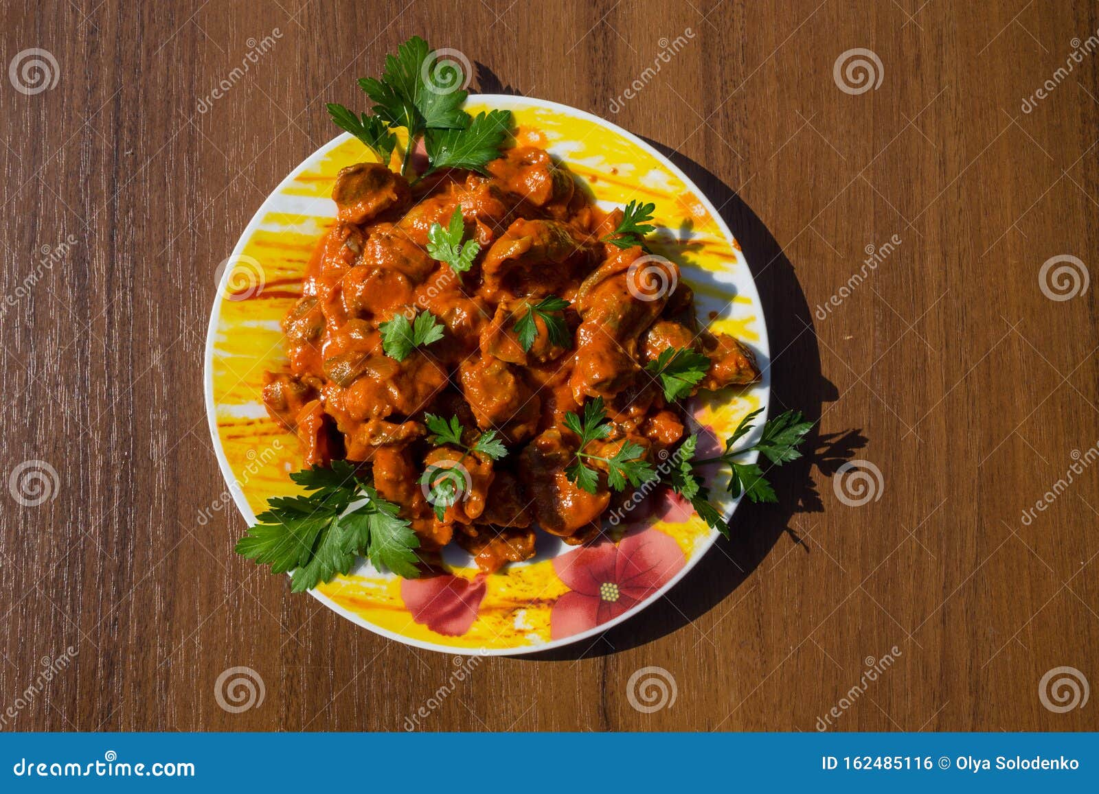 Chicken Gizzard Stew in Plate on Wooden Table Stock Photo - Image of ...