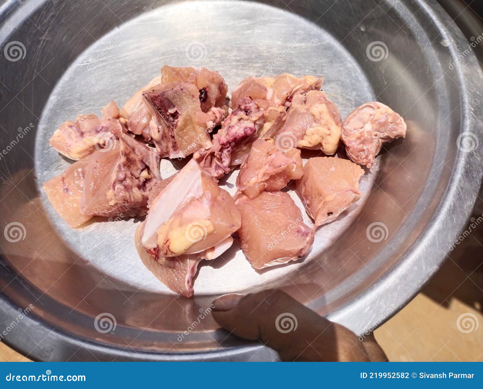 Chicken and hand stock photo. Image of roasting, chicken - 219952582