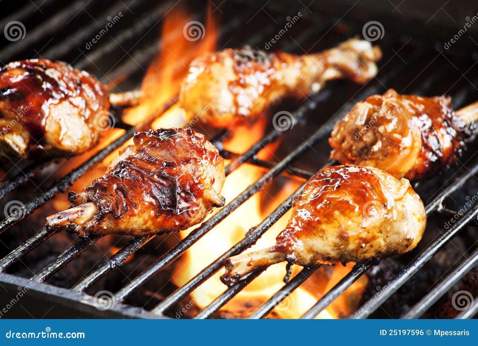 Chicken Legs on the Grill stock photo. Image of black - 25197596