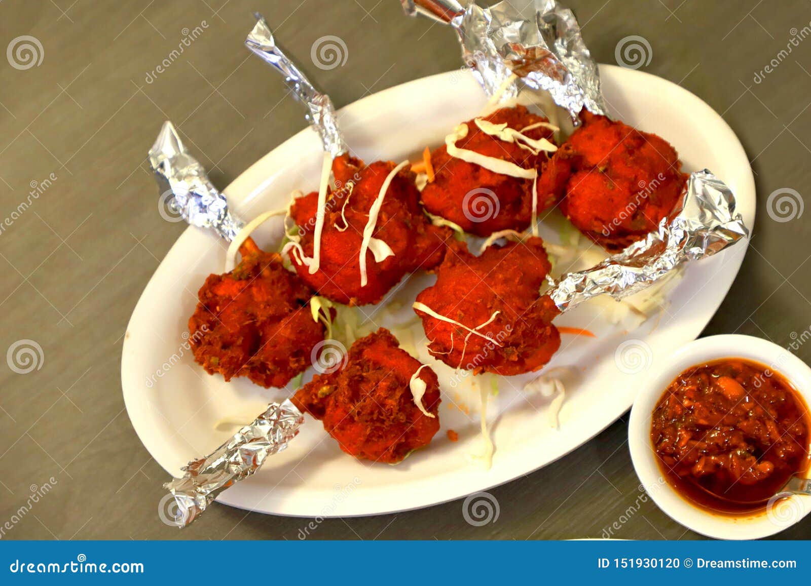 Chicken Lollipop with Schezwan Chutney Stock Photo - Image of barbeque ...