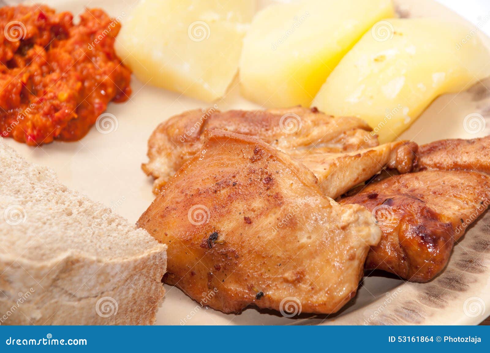 Chicken Meat Served with Ajvar and Potato Stock Photo - Image of food ...