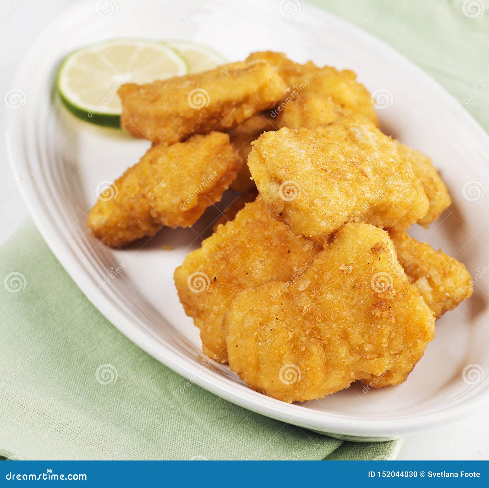 Chicken nuggets in a plate stock photo. Image of dish - 152044030