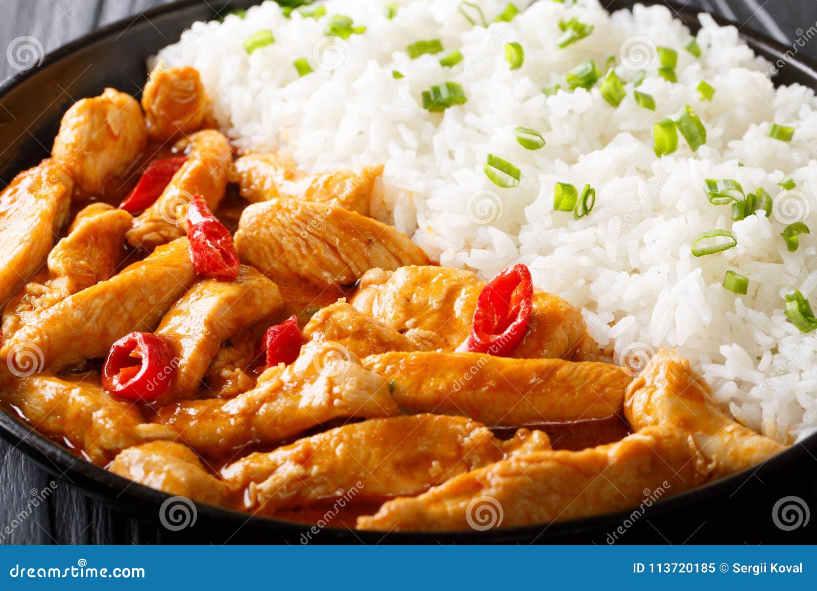 Chicken Panang Curry with Garnish of Rice Close-up. Horizontal Stock ...