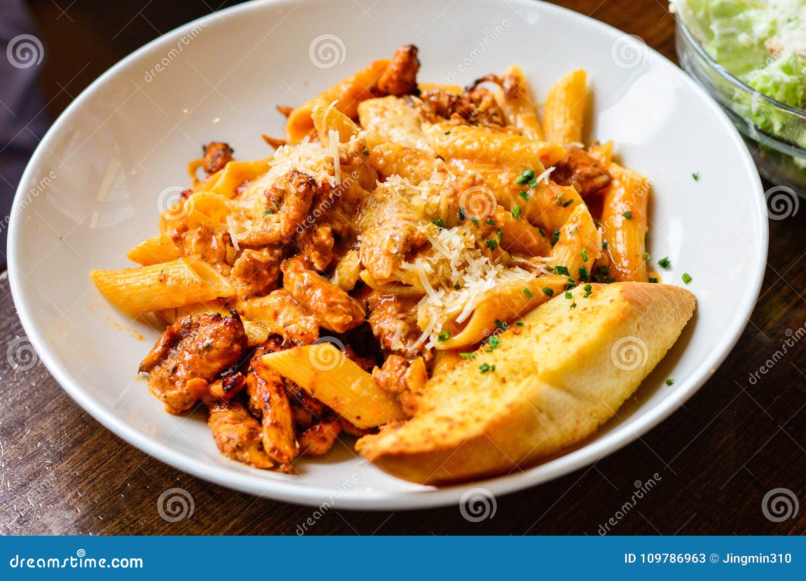 Chicken Pasta with Parmesan Cheese and Galric Bread Stock Image - Image ...