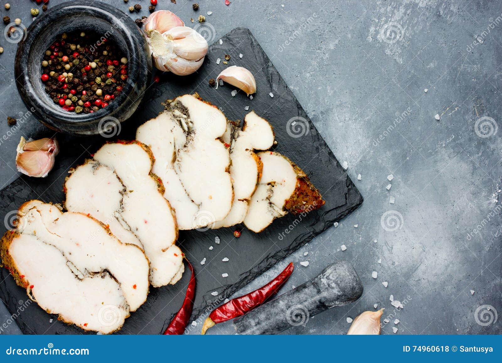 Chicken Pastrami with Pepper and Garlic on a Stone Plate Stock Photo ...