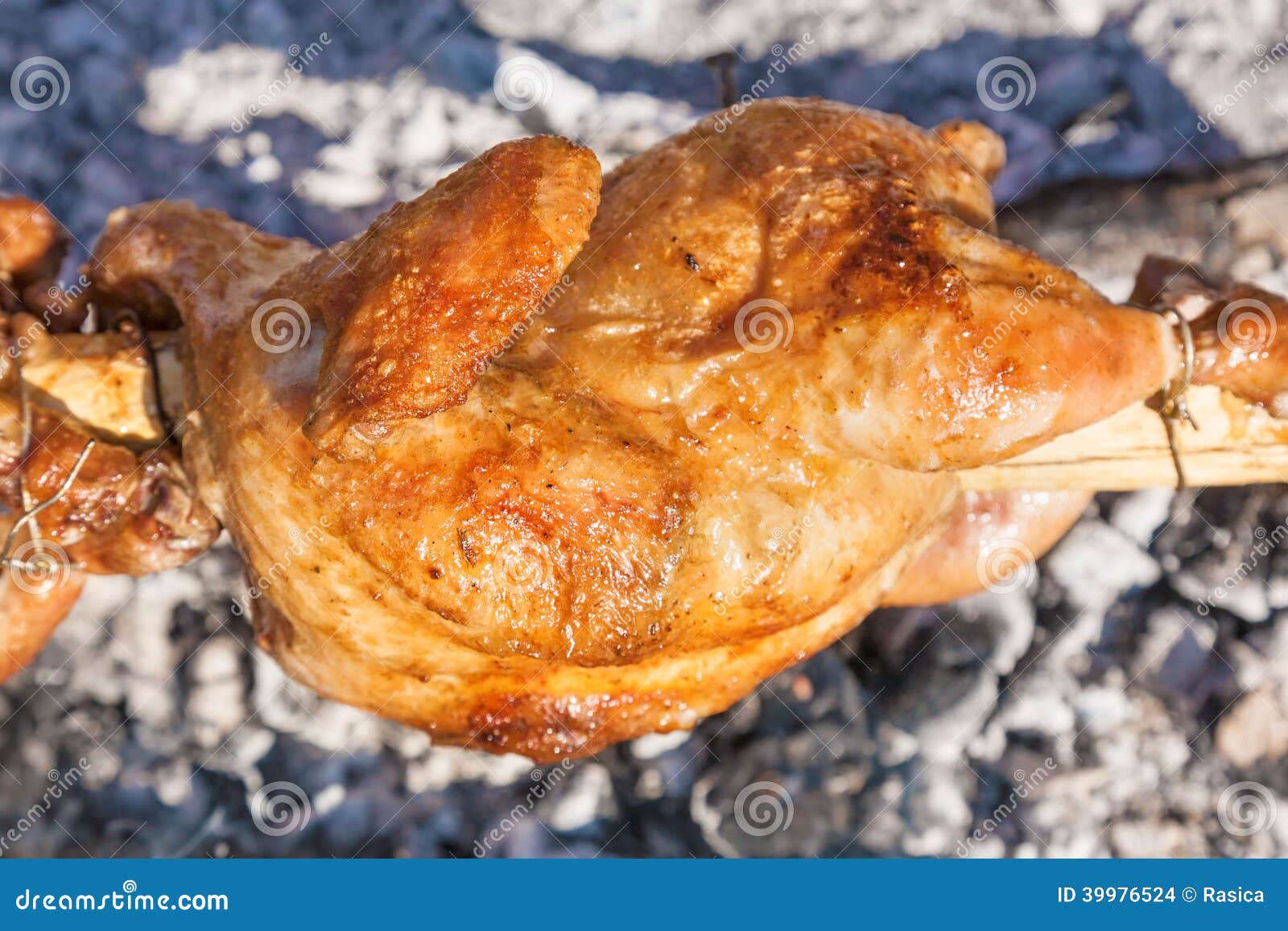 Chicken roasted on a spit stock photo. Image of juicy - 39976524