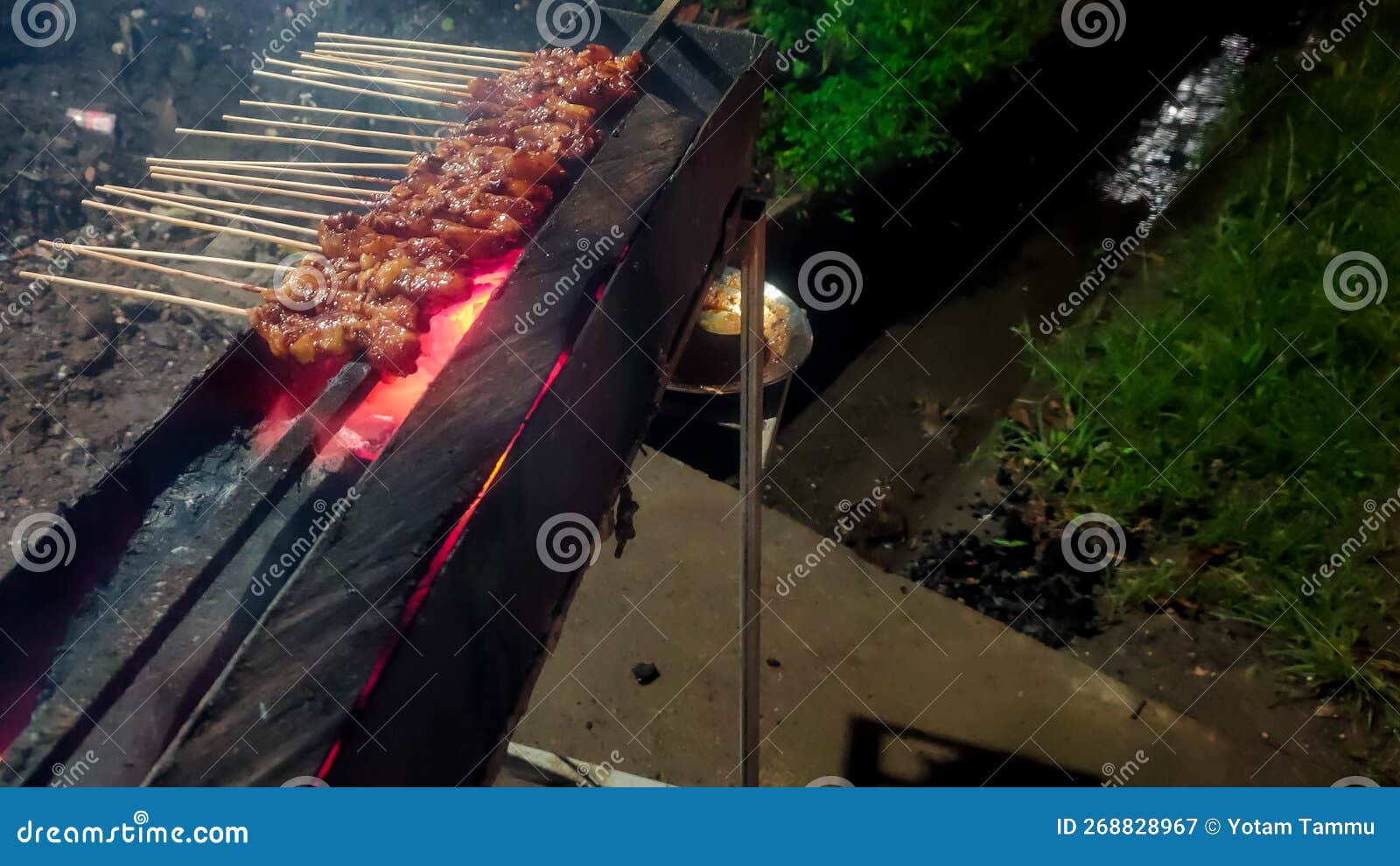 Chicken Satay in the Process of Burning with Charcoal Fire while on the ...