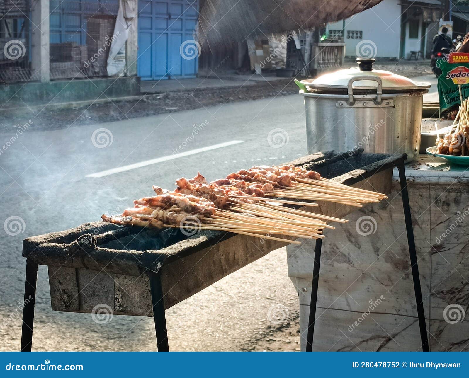 A Chicken Satay Seller is Cooking Satay on the Side of the Road Stock ...