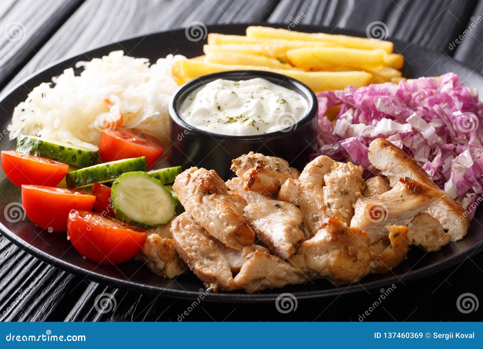Chicken Shawarma with Vegetables and Sauce Serving on a Plate Close-up ...