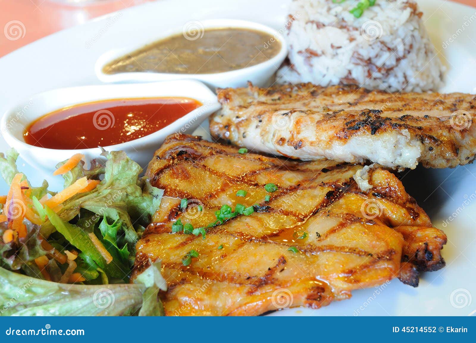Chicken Spicy and Pock Grilled with Sauces and Brown Rice. Stock Photo ...