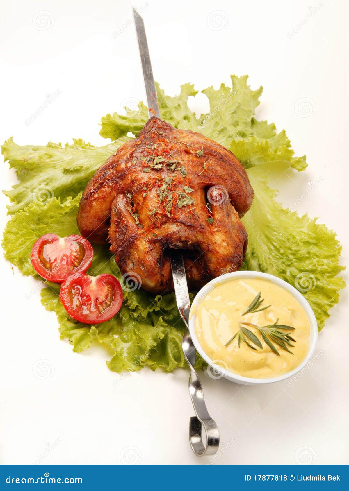 Chicken on spit stock photo. Image of leaf, sauce, tomato - 17877818