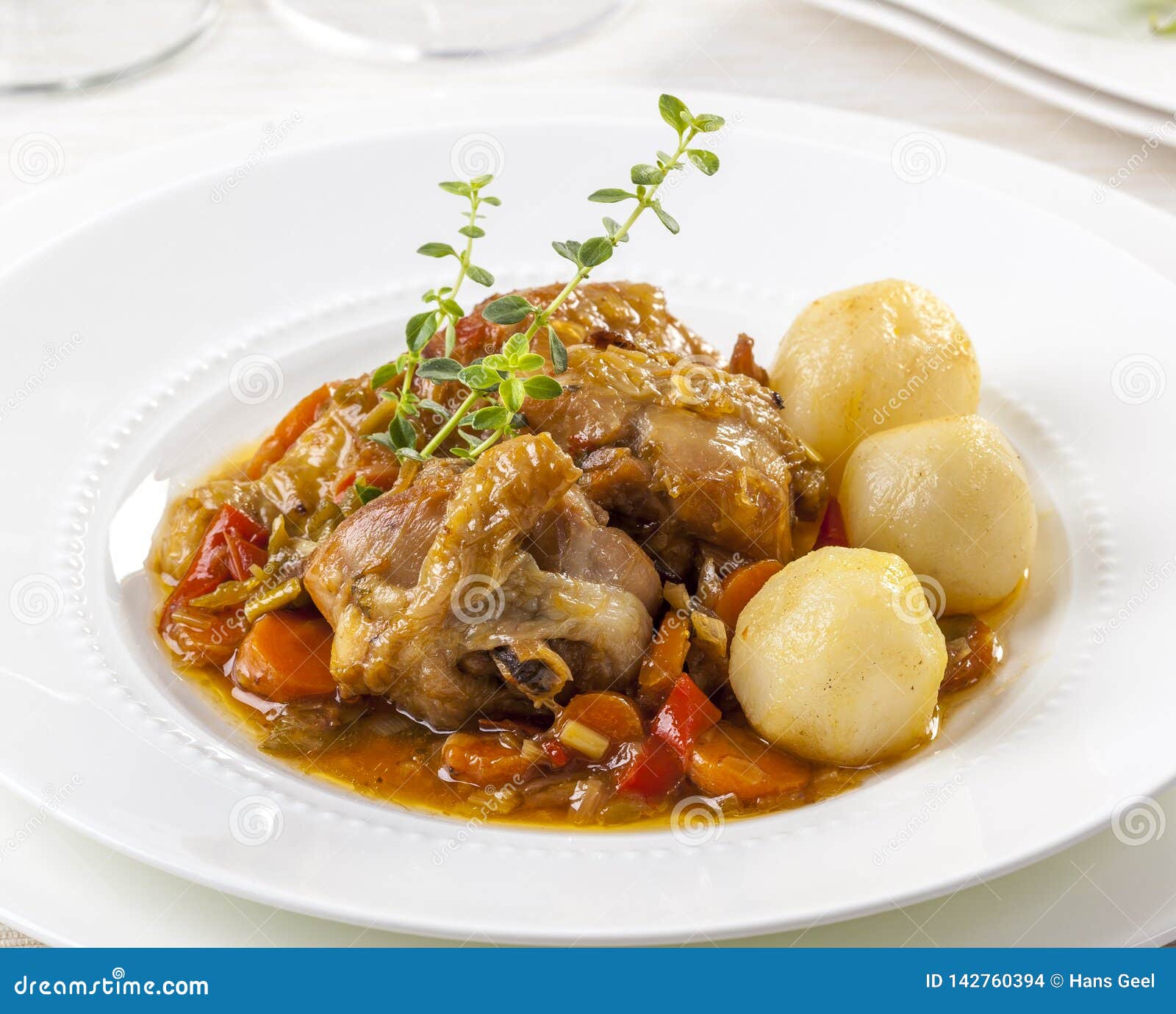 Chicken Stew on White Plate Stock Photo - Image of napkin, pepper ...