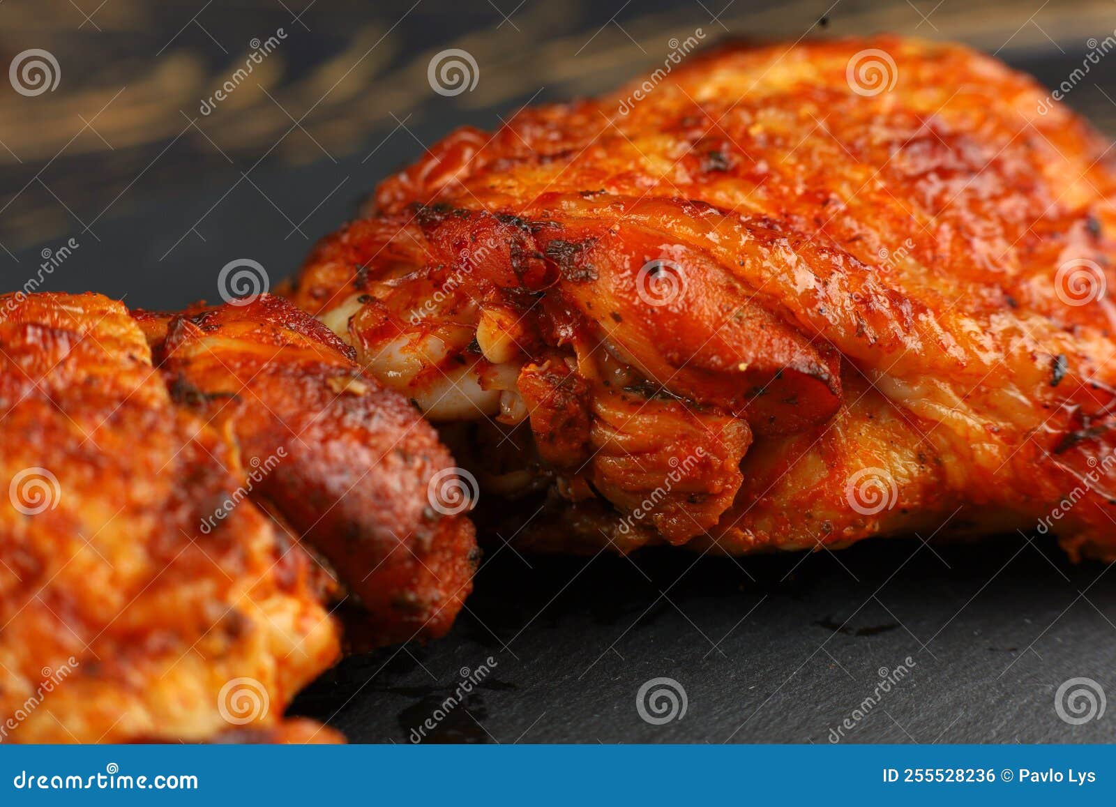 Chicken Thighs Baked. Grilled Chicken Thighs on Plate Over Dark Stone ...