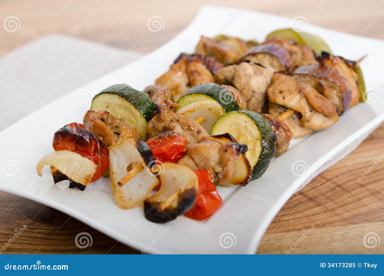 Chicken and Vegetable Kabobs on White Plate Stock Image - Image of ...