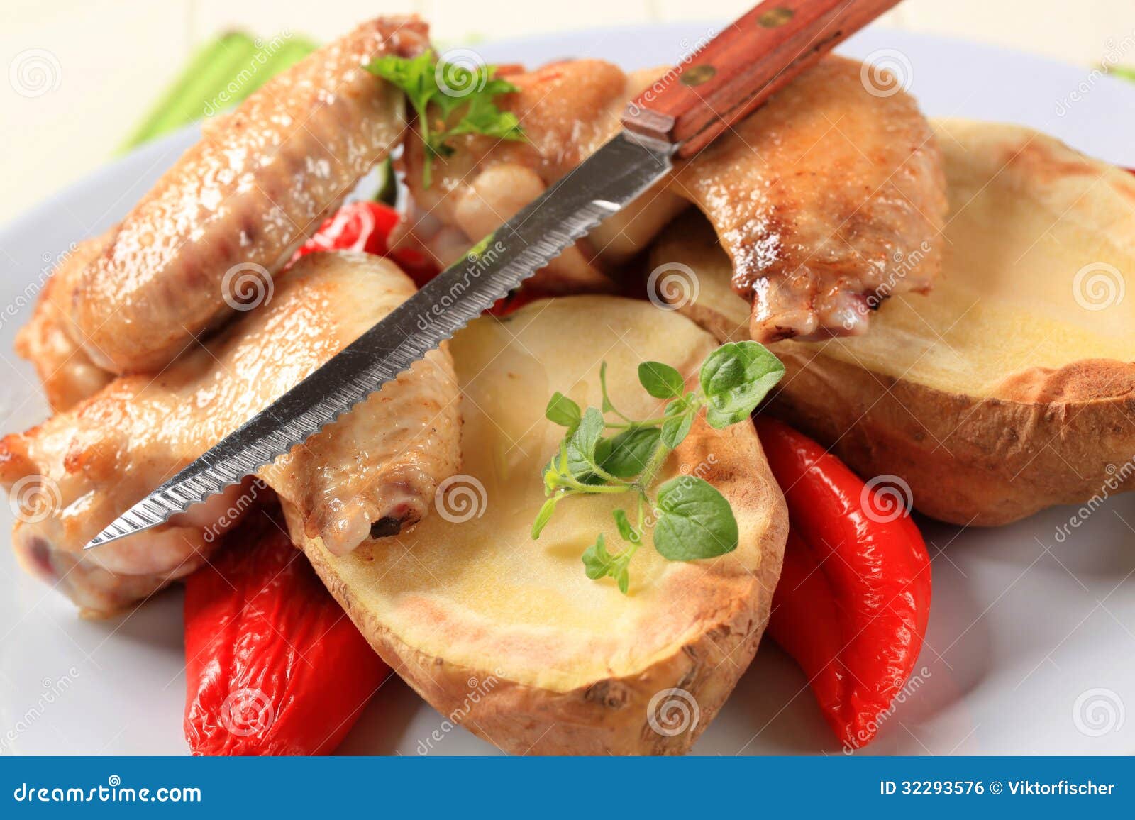 Chicken Wings with Baked Potato Stock Photo - Image of plate, marinated ...