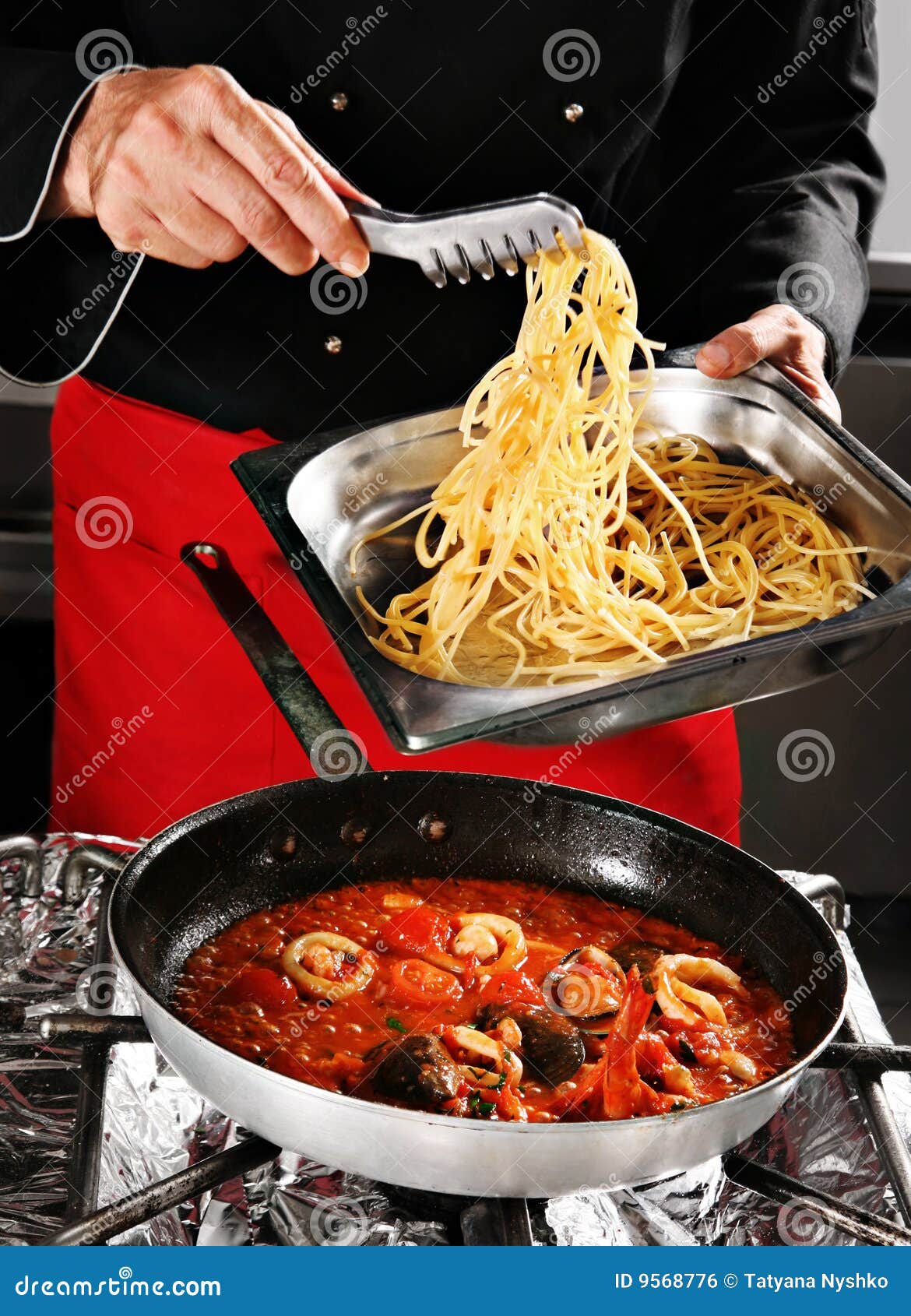 Chief add pasta in pan stock photo. Image of vegetable - 9568776