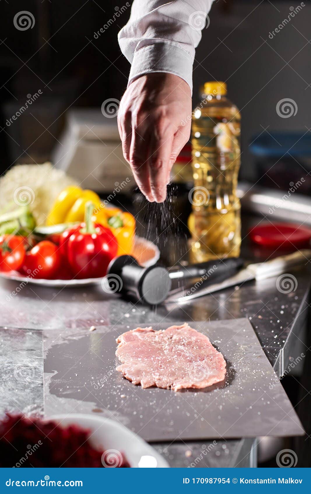 Chief Chops and Marinates Pork. Professional Chef in a Kitchen of ...