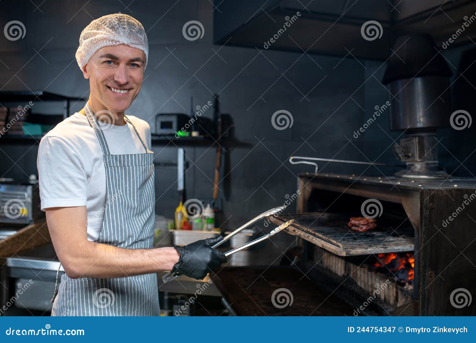 A Chief-cooker Cooking in the Kitchen in the Restaurant Stock Image ...