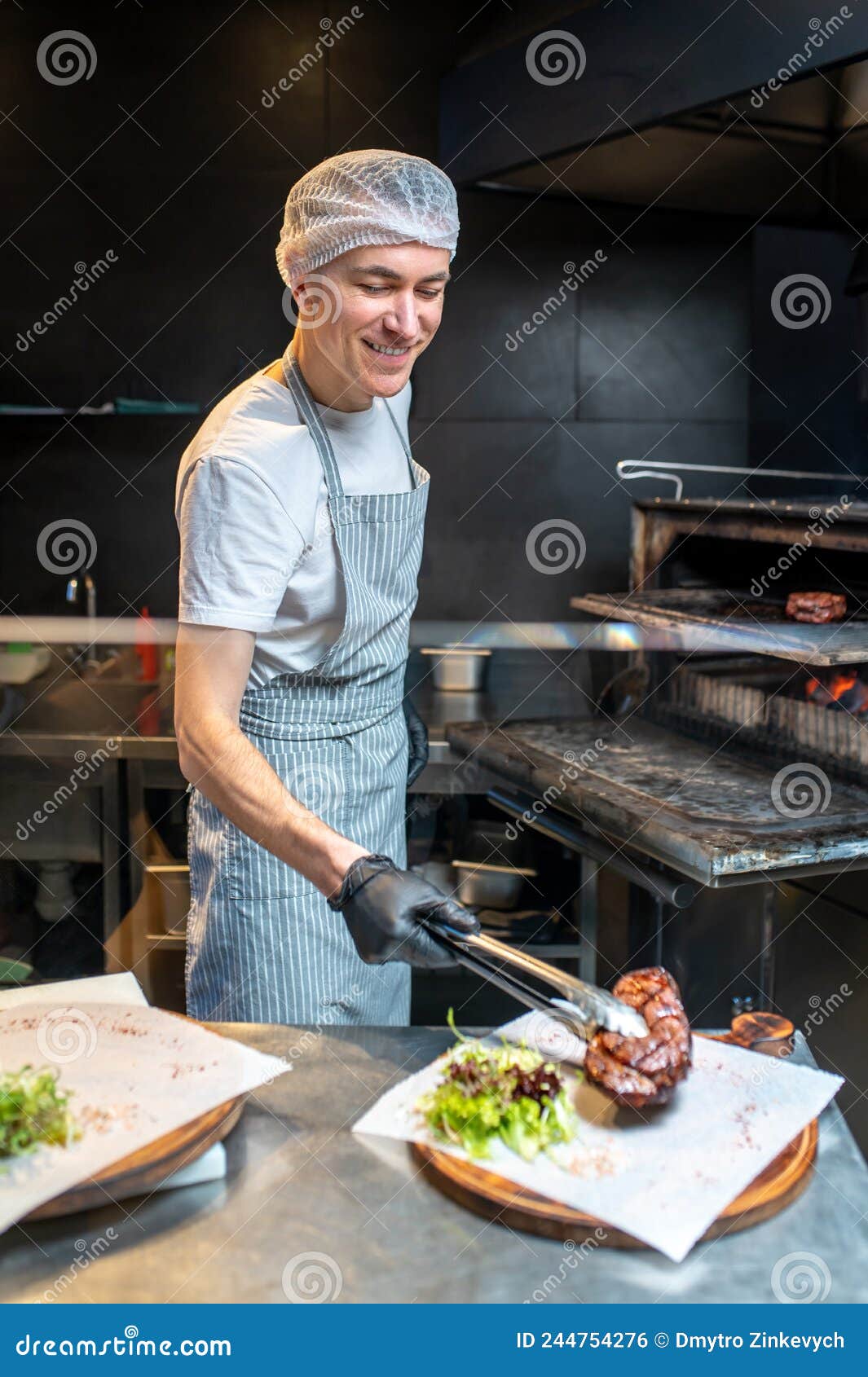 A Chief-cooker Working in the Kitchen in the Restaurant Stock Photo ...