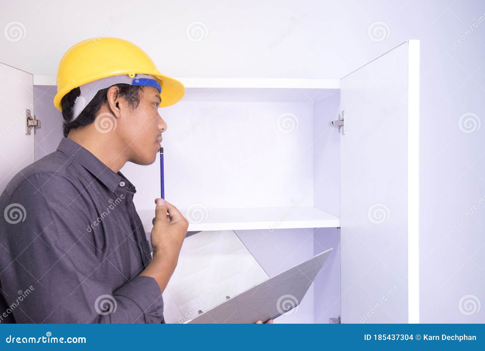 The Chief Engineer is Checking the Integrity of the Cabinet Door Repair ...