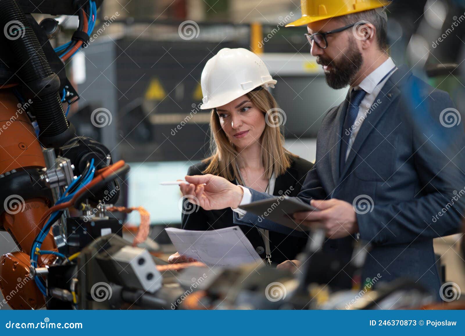 Chief Engineer and Project Manager in Modern Industrial Factory with ...