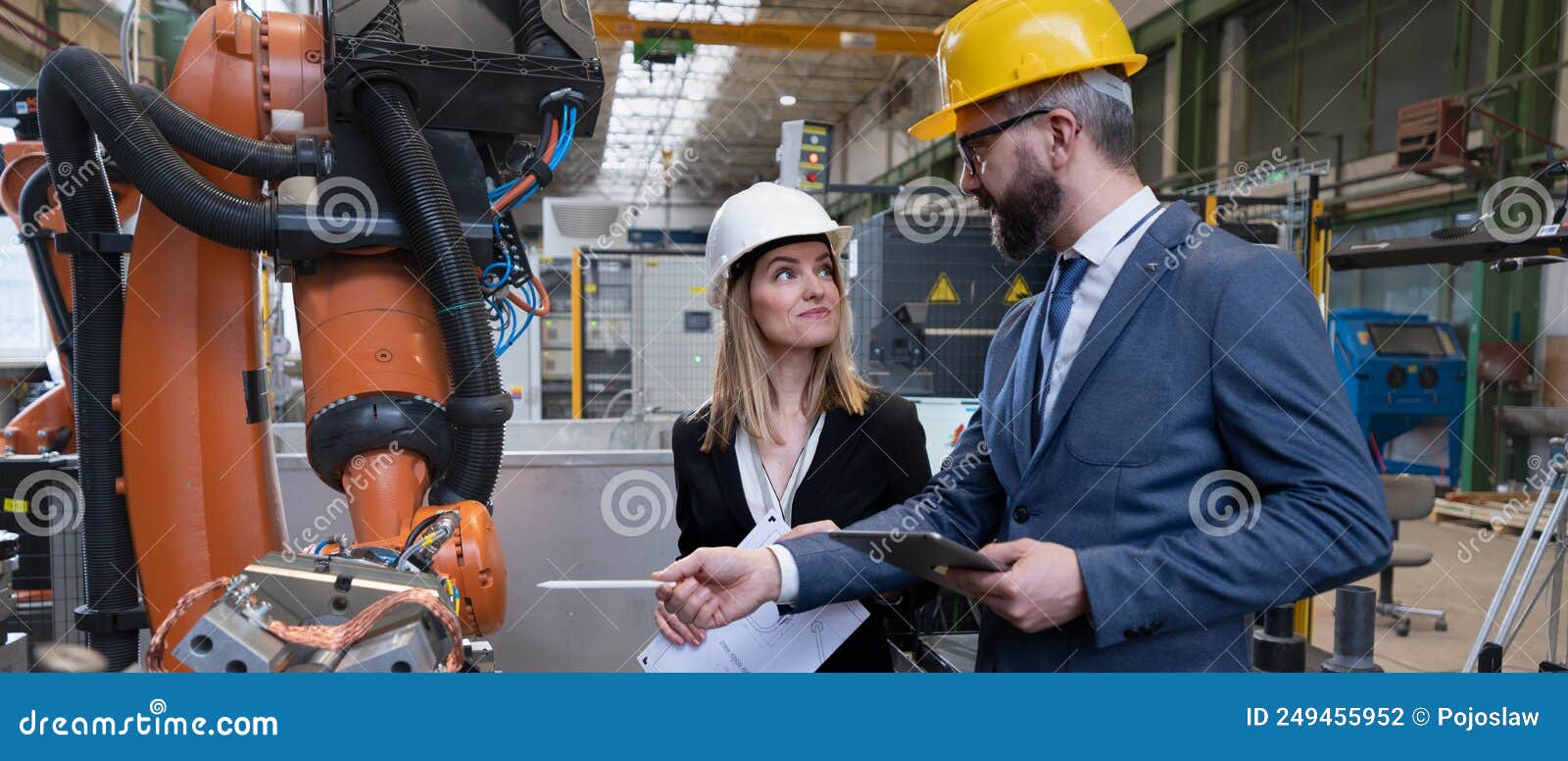 Chief Engineer and Project Manager in Modern Industrial Factory with ...